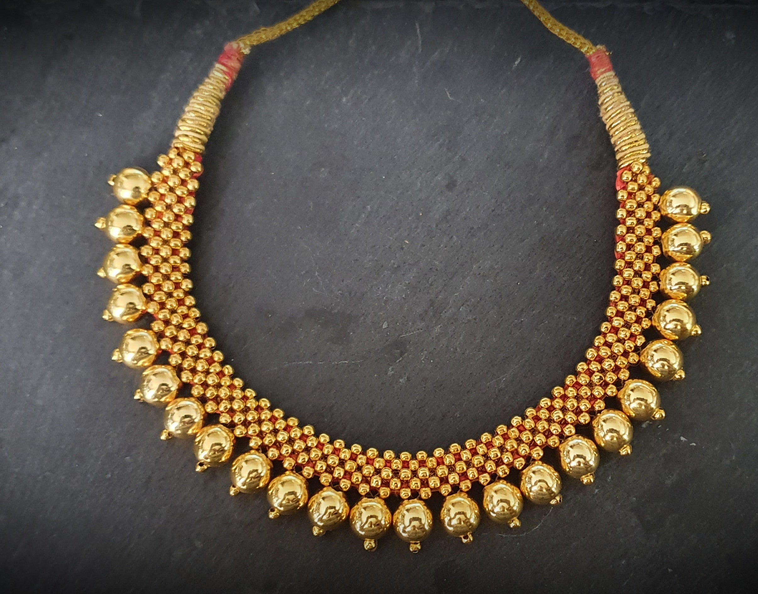 Golden bead Thushi – PRAAGNEEK